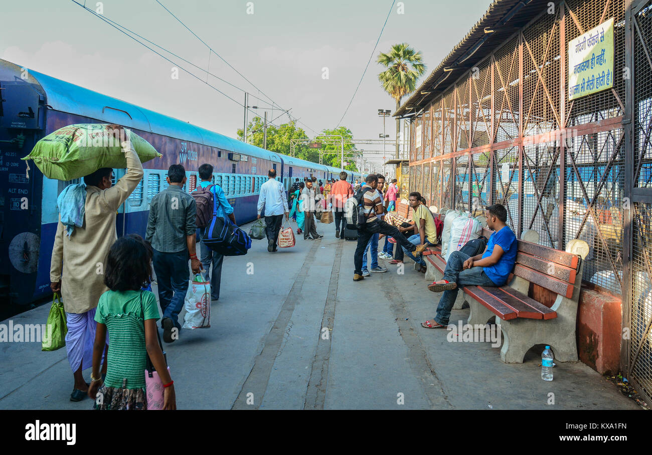 Varanasi, India - Jul 12, 2015. Passengers walk at railway station in ...