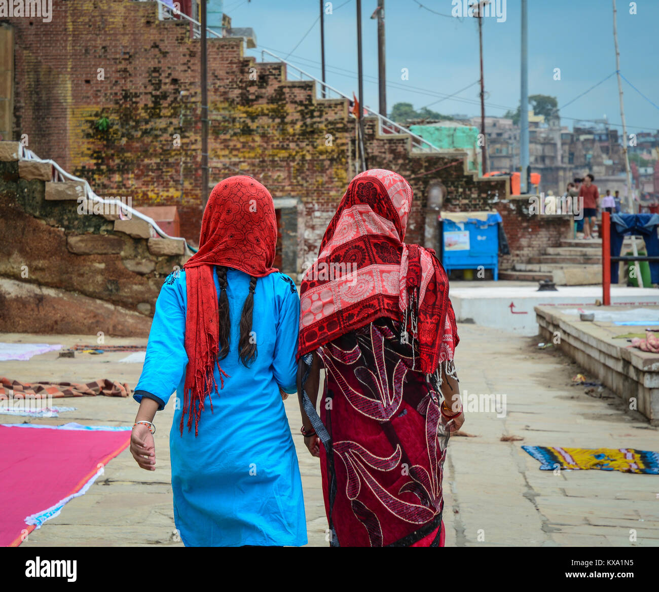 Women in sari (traditional clothes) walking on street in Varanasi ...