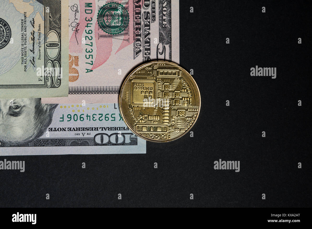 Golden bitcoin on dollar paper bills or banknotes with black text space ...