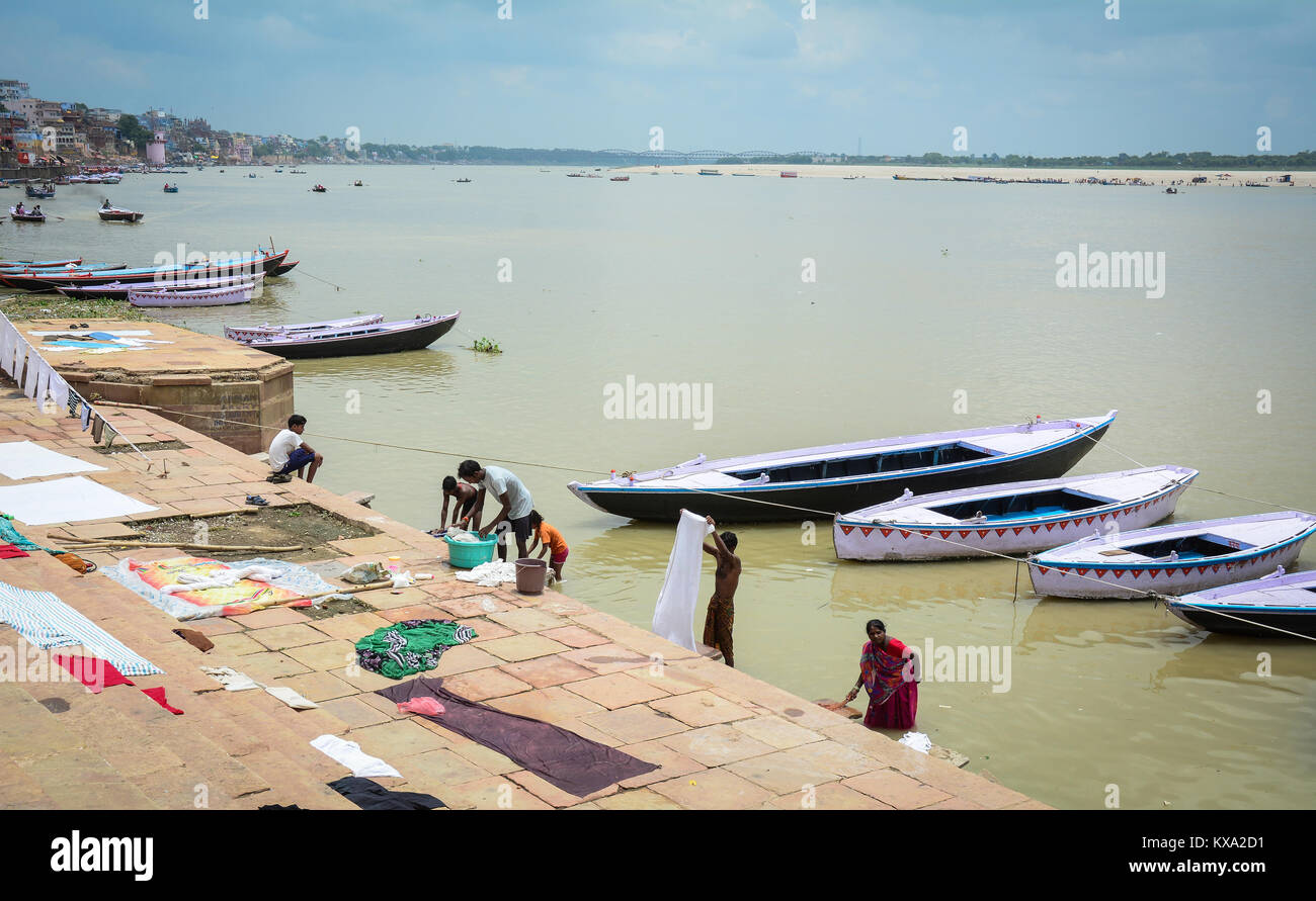 Varanasi, India - Jul 12, 2015. People drying clothes on riverbank in ...