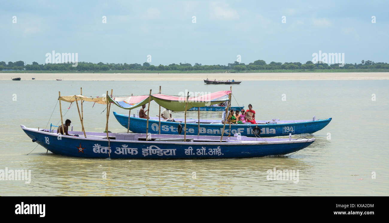 Varanasi, India - Jul 12, 2015. Wooden boats run on Ganges River in ...