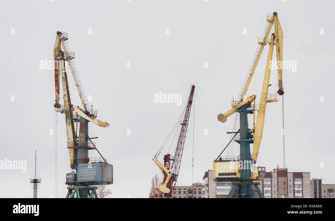 Old rusty harbor cranes standing in the port Stock Photo - Alamy