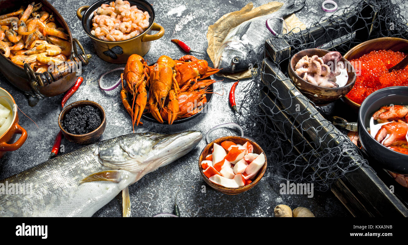 Different fresh seafood. On a rustic background Stock Photo - Alamy