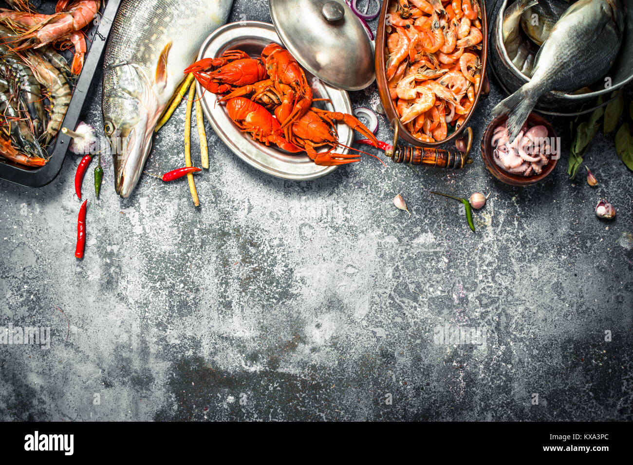 Different fresh seafood. On a rustic background Stock Photo - Alamy