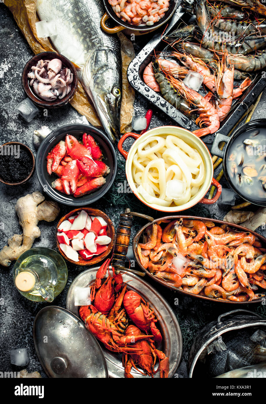 Different fresh seafood. On a rustic background Stock Photo - Alamy