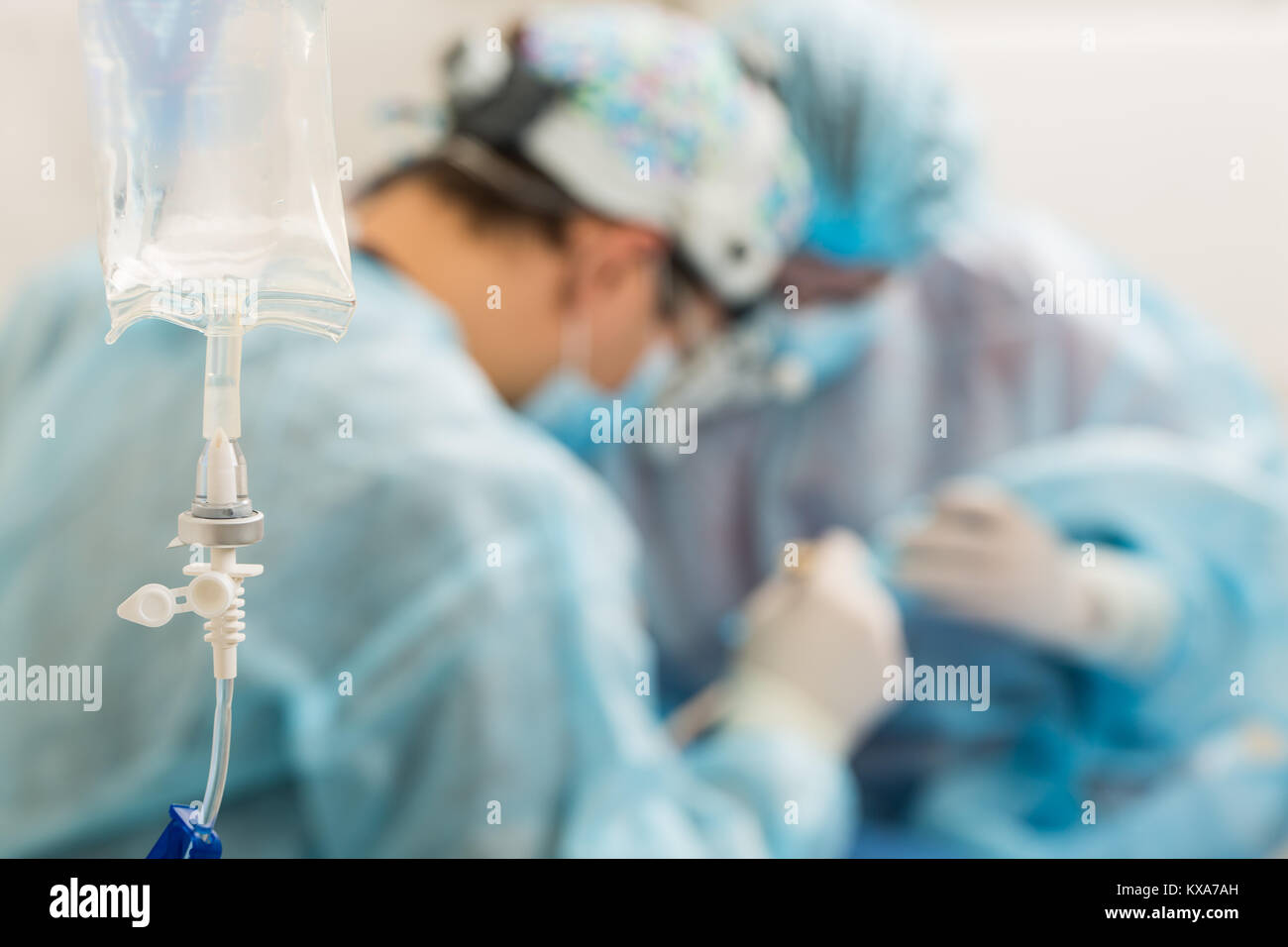Medical drop counter on the blurry background of the group of doctors ...