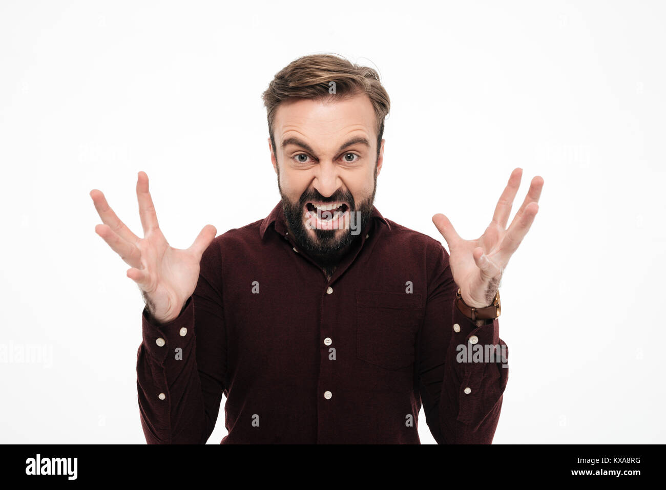 Portrait of an angry furious man shouting and gesturing with hands ...