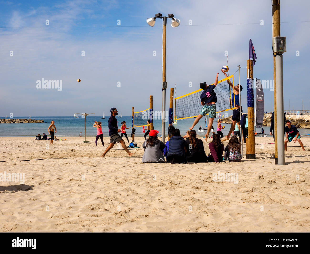 Group of young people playing volleyball on the beach of Tel Baruch ...