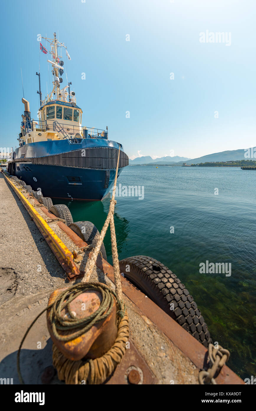 Tugboat or fishing boat in docks of Alesund, Norway, Europe. Ship in ...