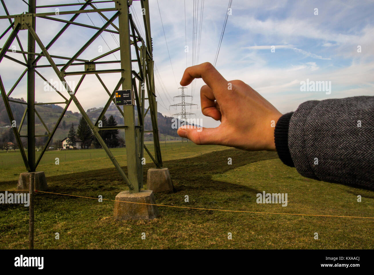 Man Holding Powerlines Stock Photo - Alamy