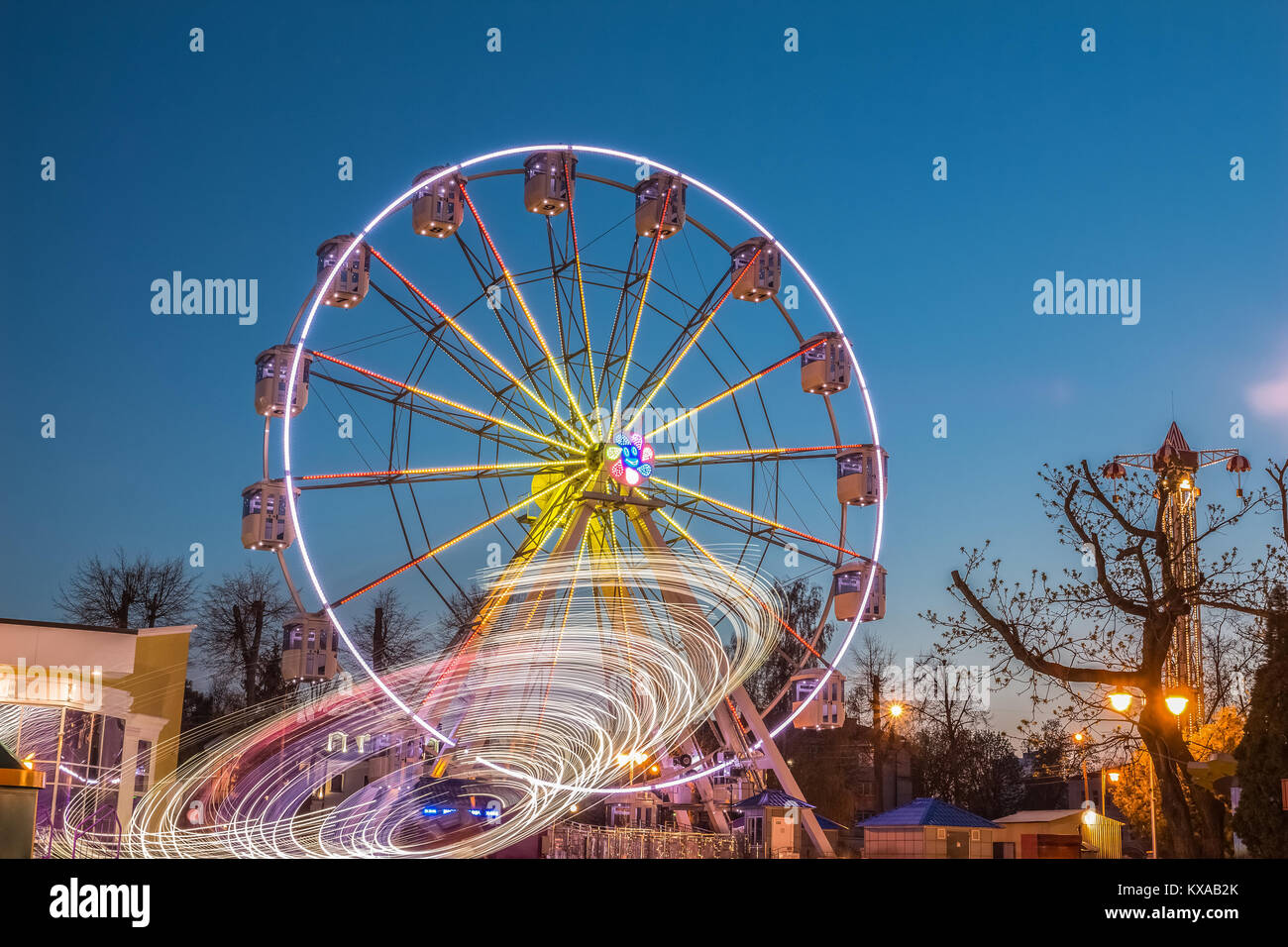 Ferris wheel with night illumination lights in the evening Amusement ...