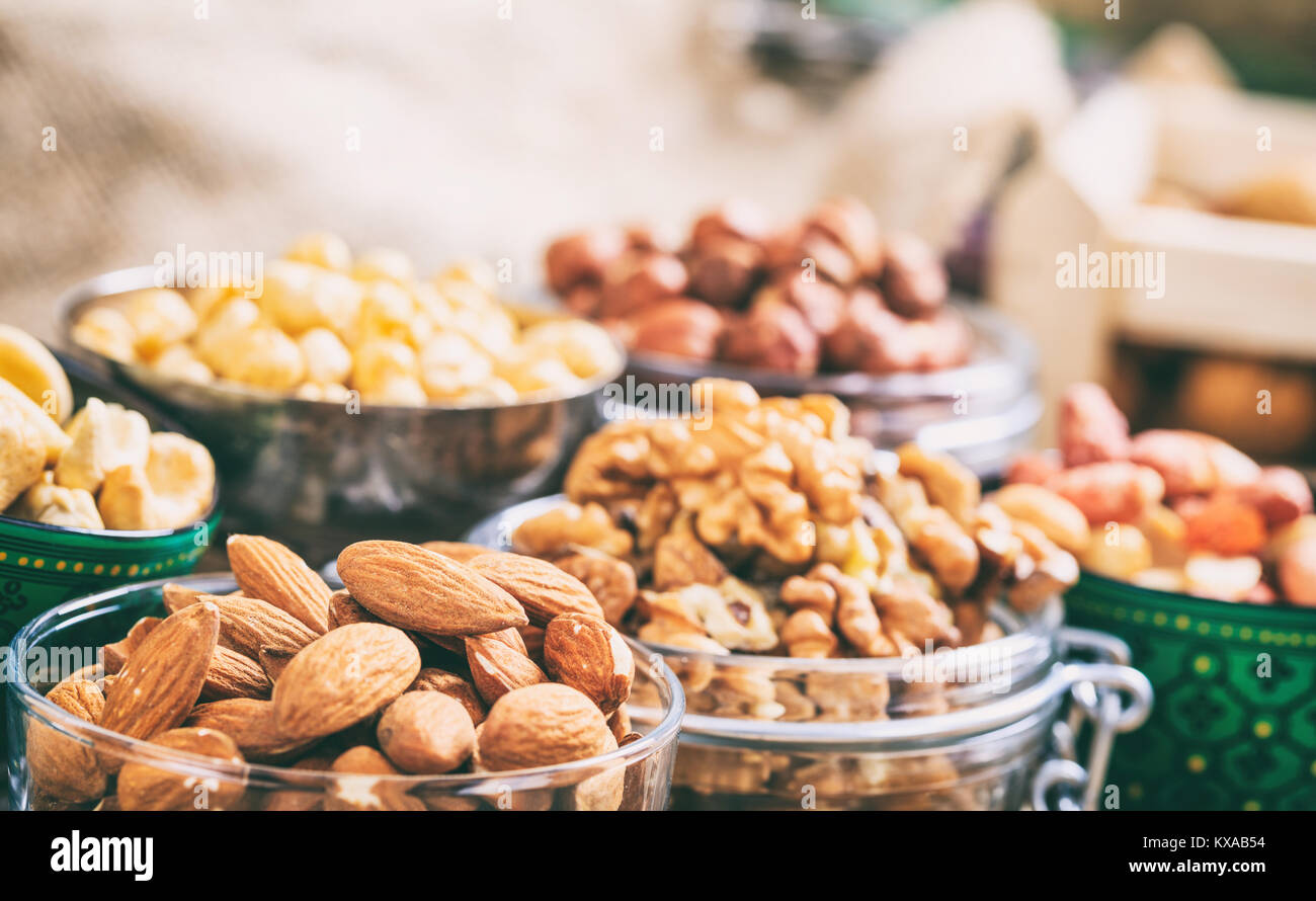 Almonds, peanuts and walnuts in bowls Stock Photo - Alamy