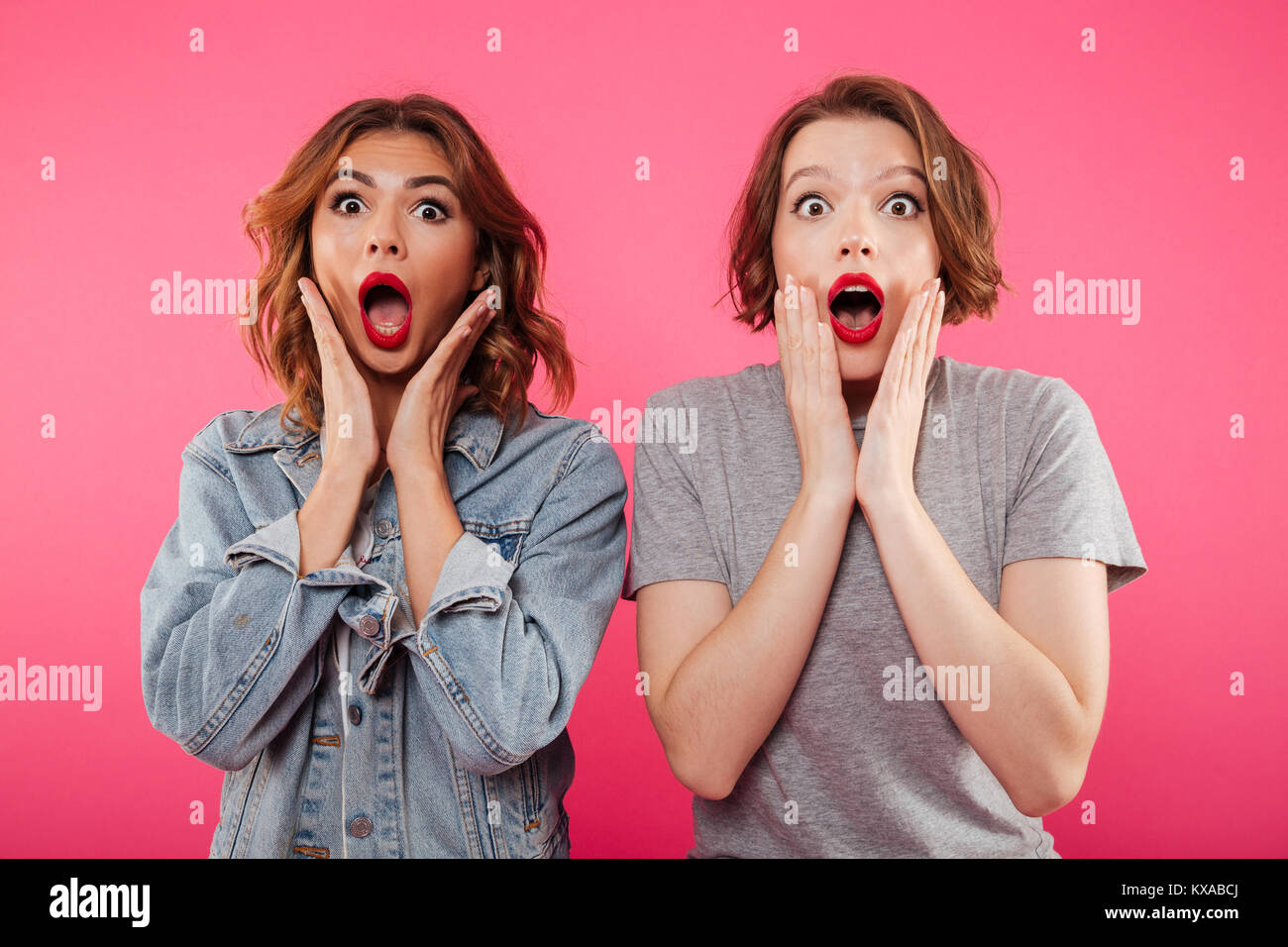 Image of shocked excited two women friends standing isolated over pink ...