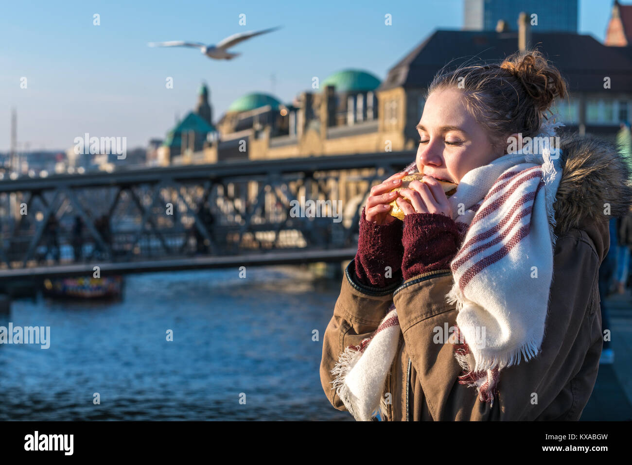 Woman eating traditional north german food fish snack Stock Photo - Alamy