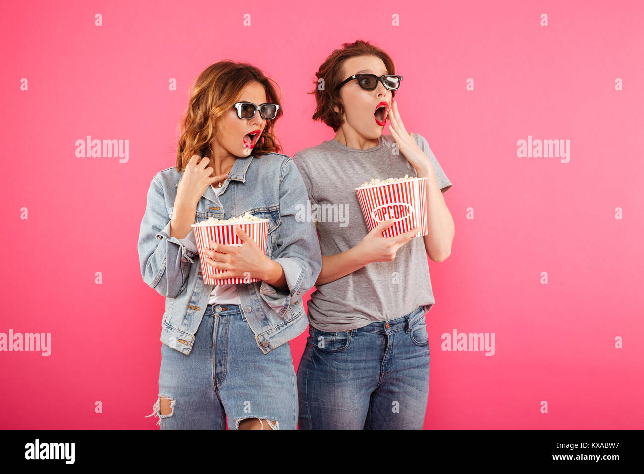 Image of two shocked women friends standing isolated over pink ...