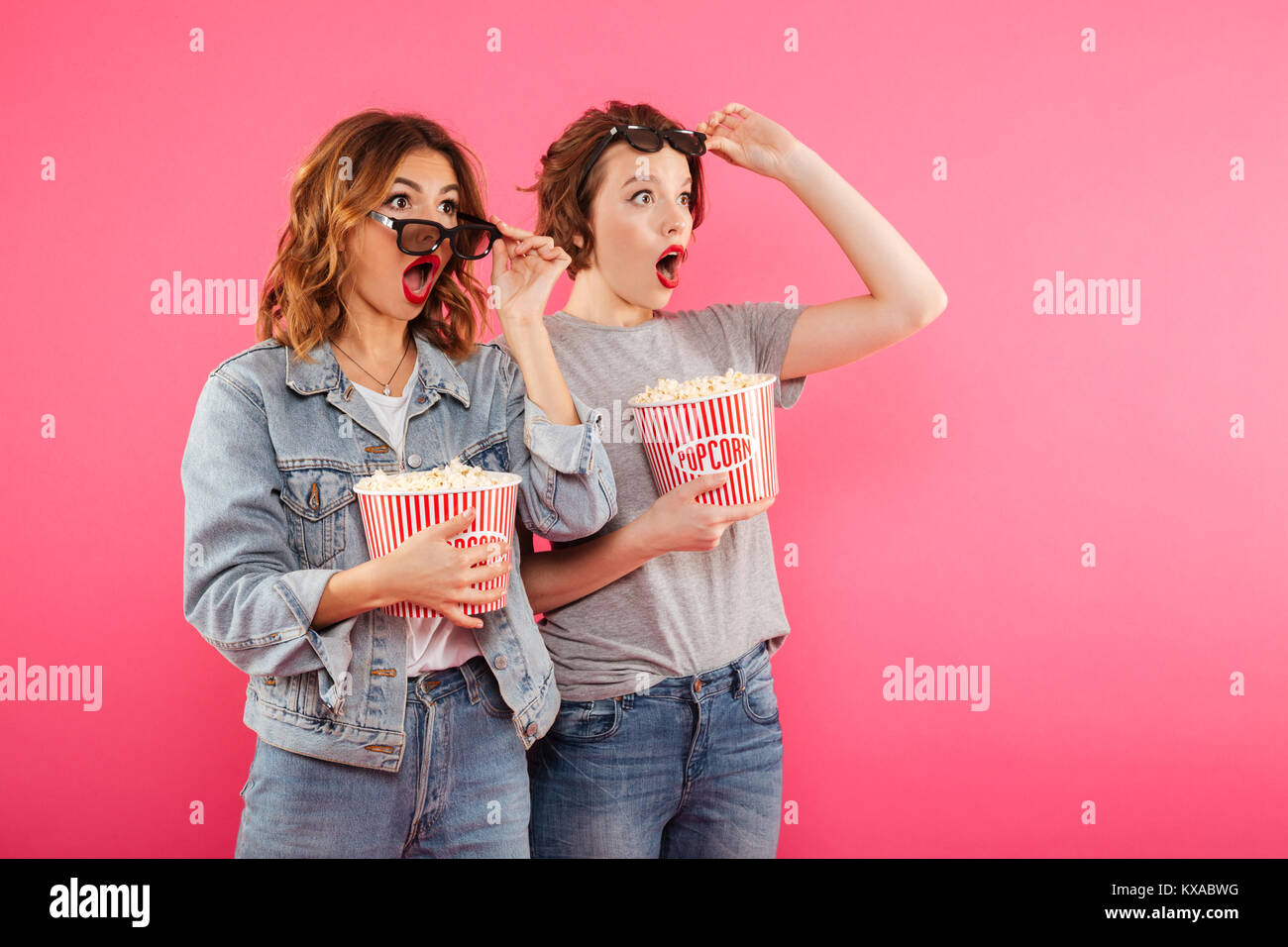 Image of two shocked women friends standing isolated over pink ...