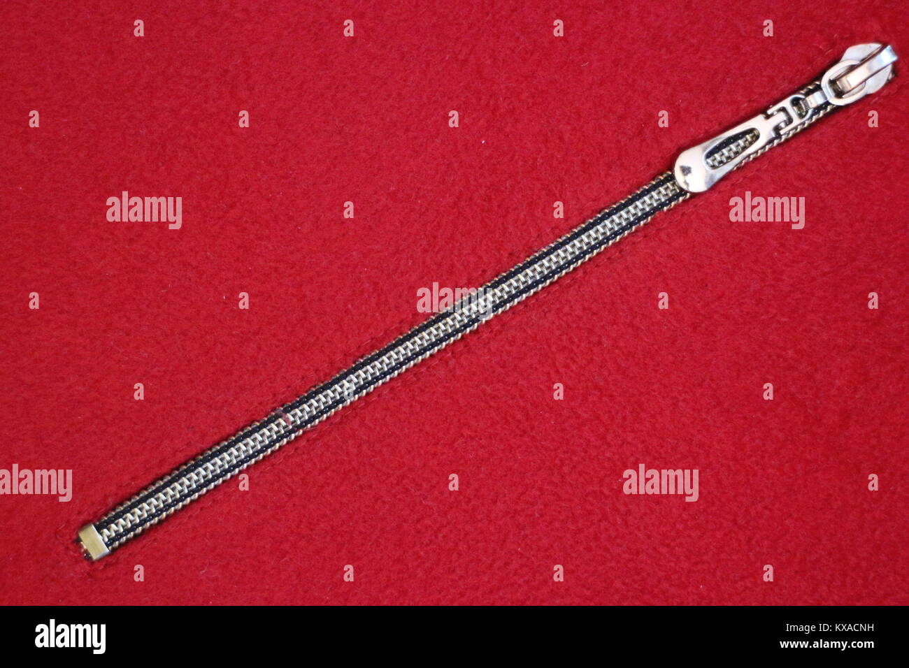 closed pocket zipper diagonal on a red background Stock Photo - Alamy
