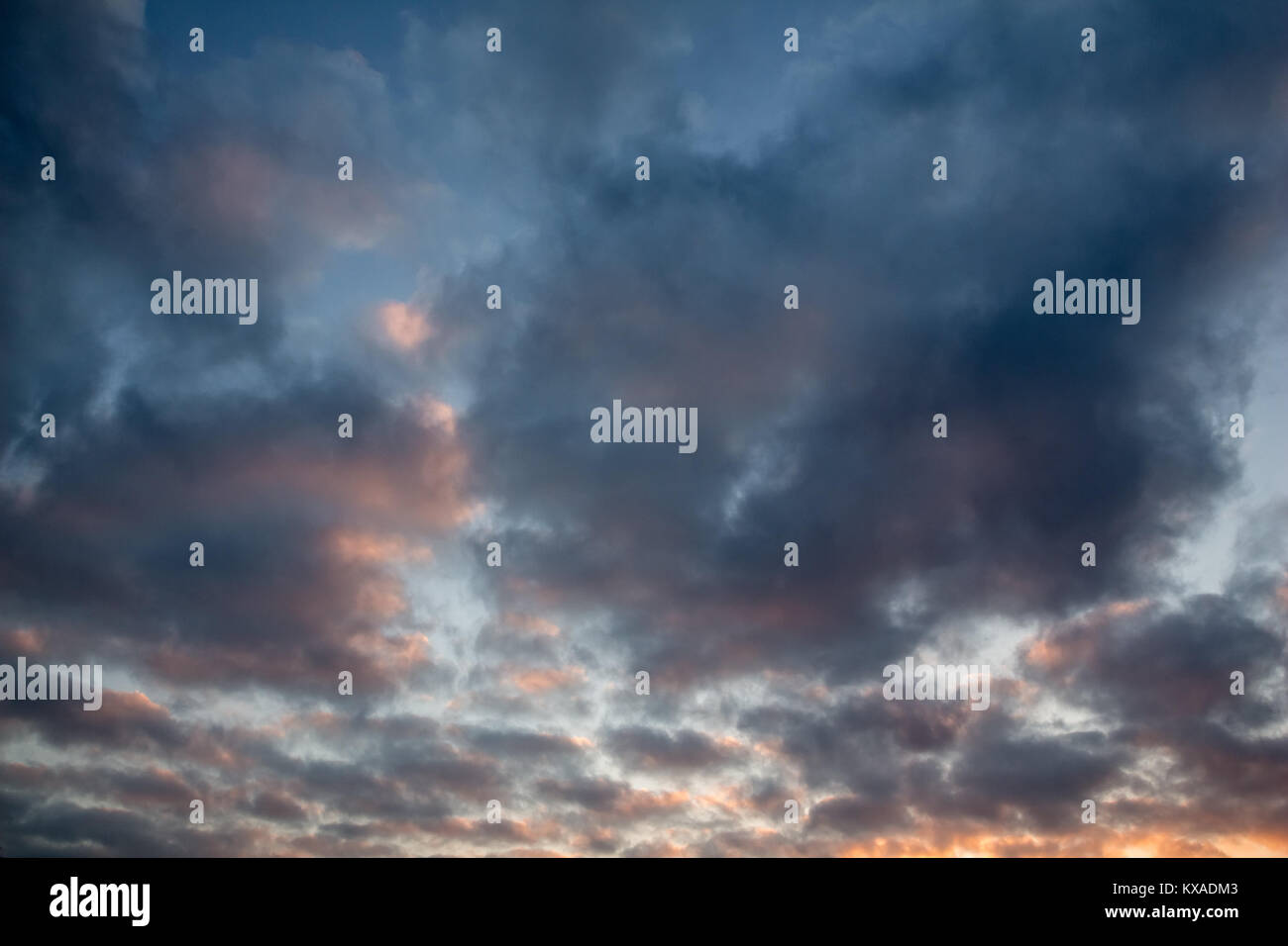 Clouds floating in the sky during sunset Stock Photo - Alamy