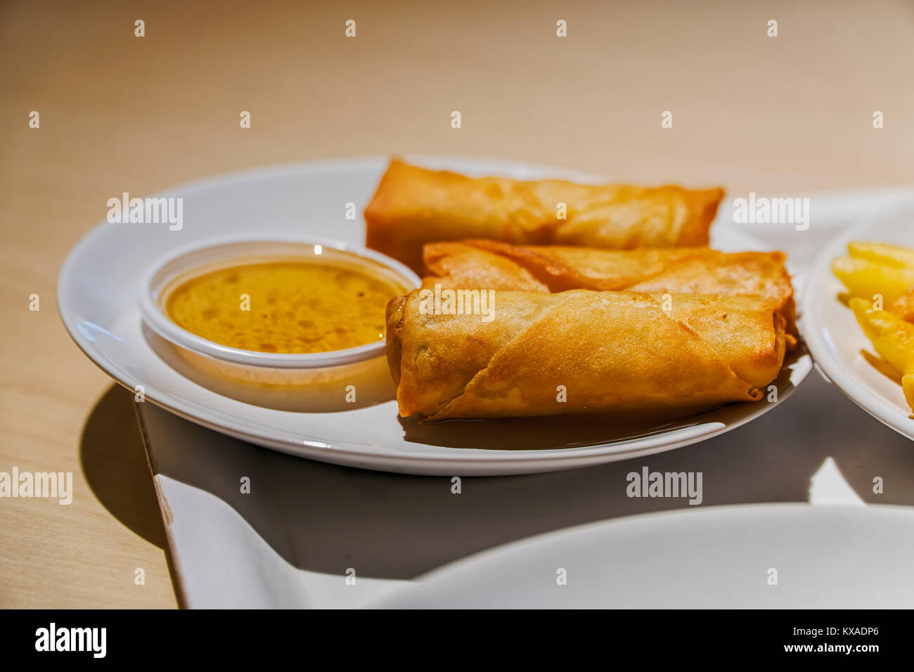 Fried spring rolls with red chilli sauce, tomato and lettuce Stock ...