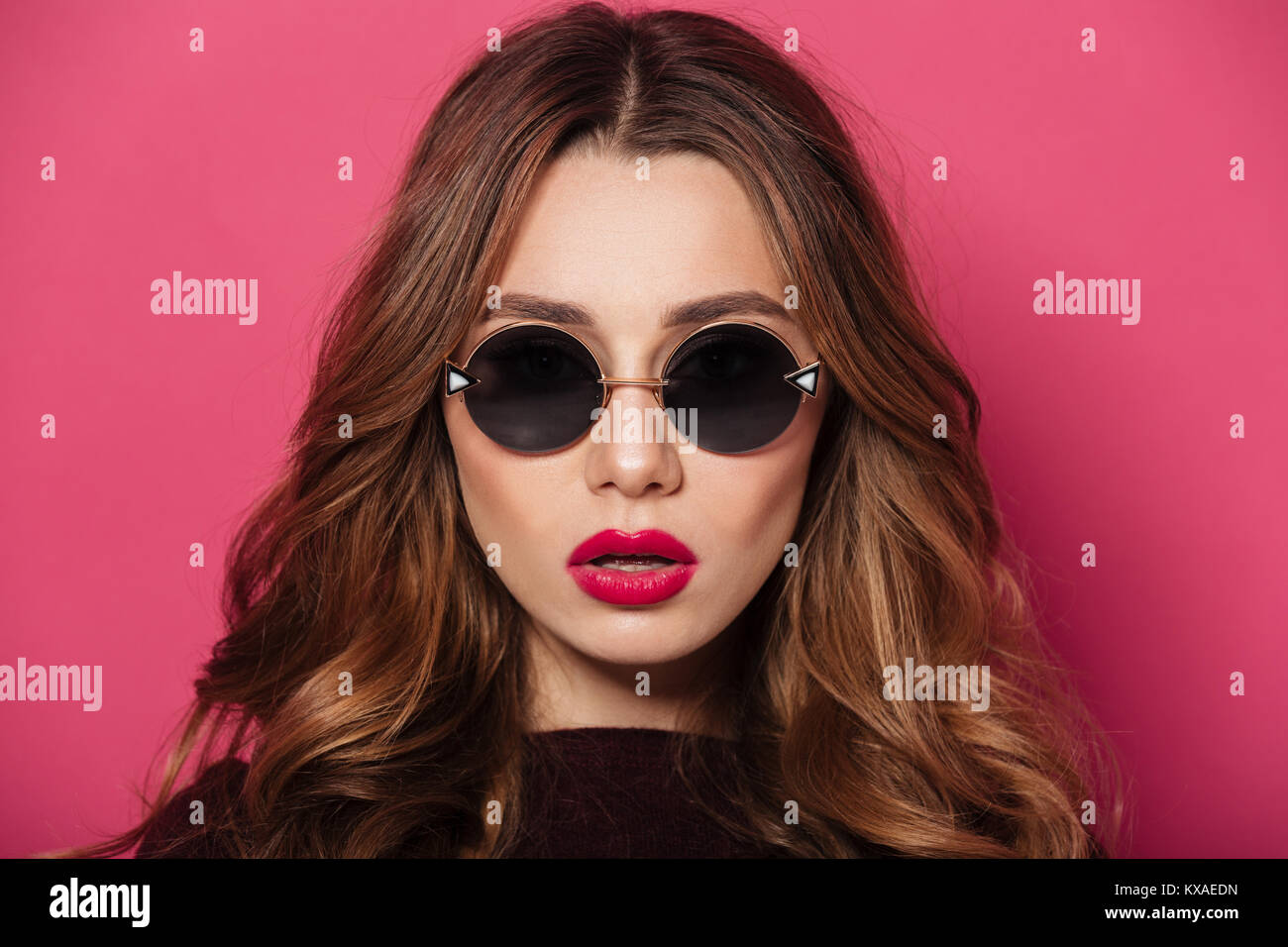 Image of serious amazing lady wearing sunglasses standing isolated over ...