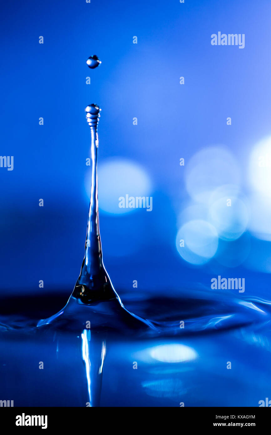Photograph of Water droplets with a coloured background. also known as ...