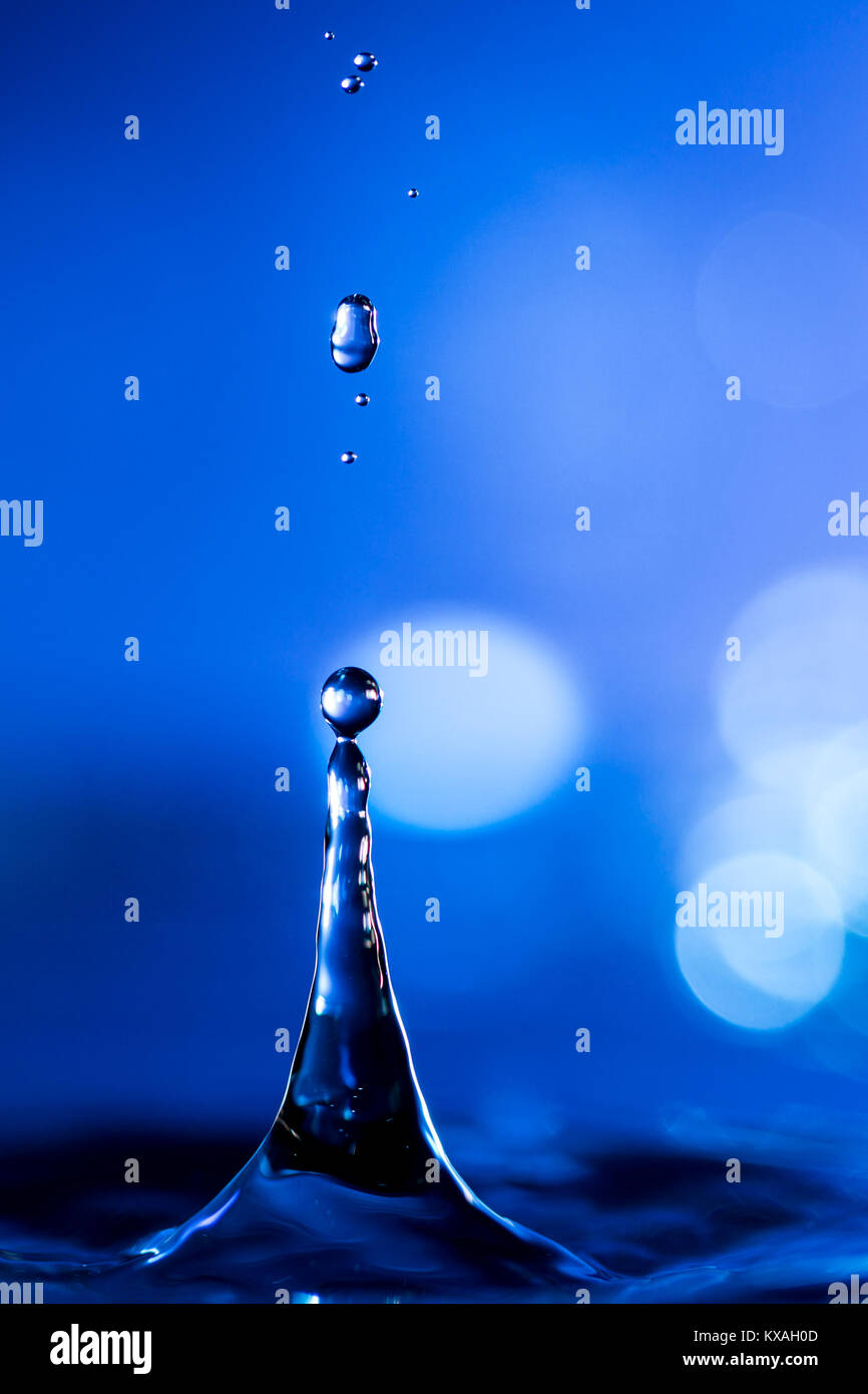 Photograph of Water droplets with a coloured background. also known as ...