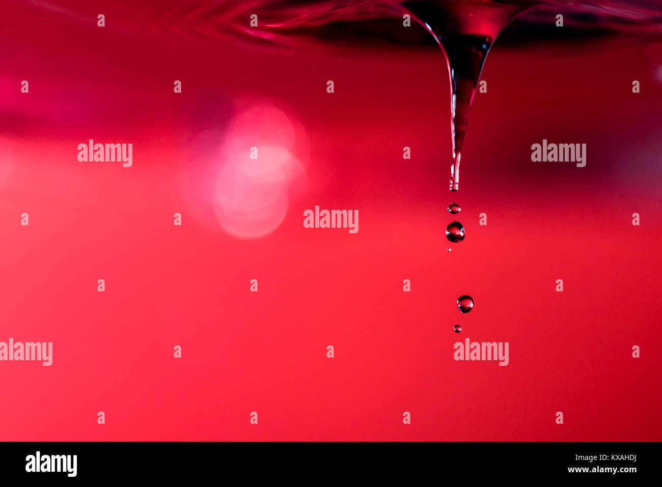 Photograph of Water droplets with a coloured background. also known as ...
