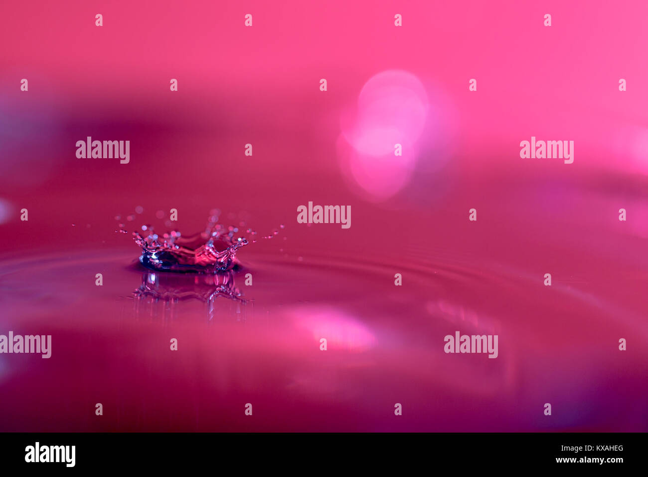 Photograph of Water droplets with a coloured background. also known as ...