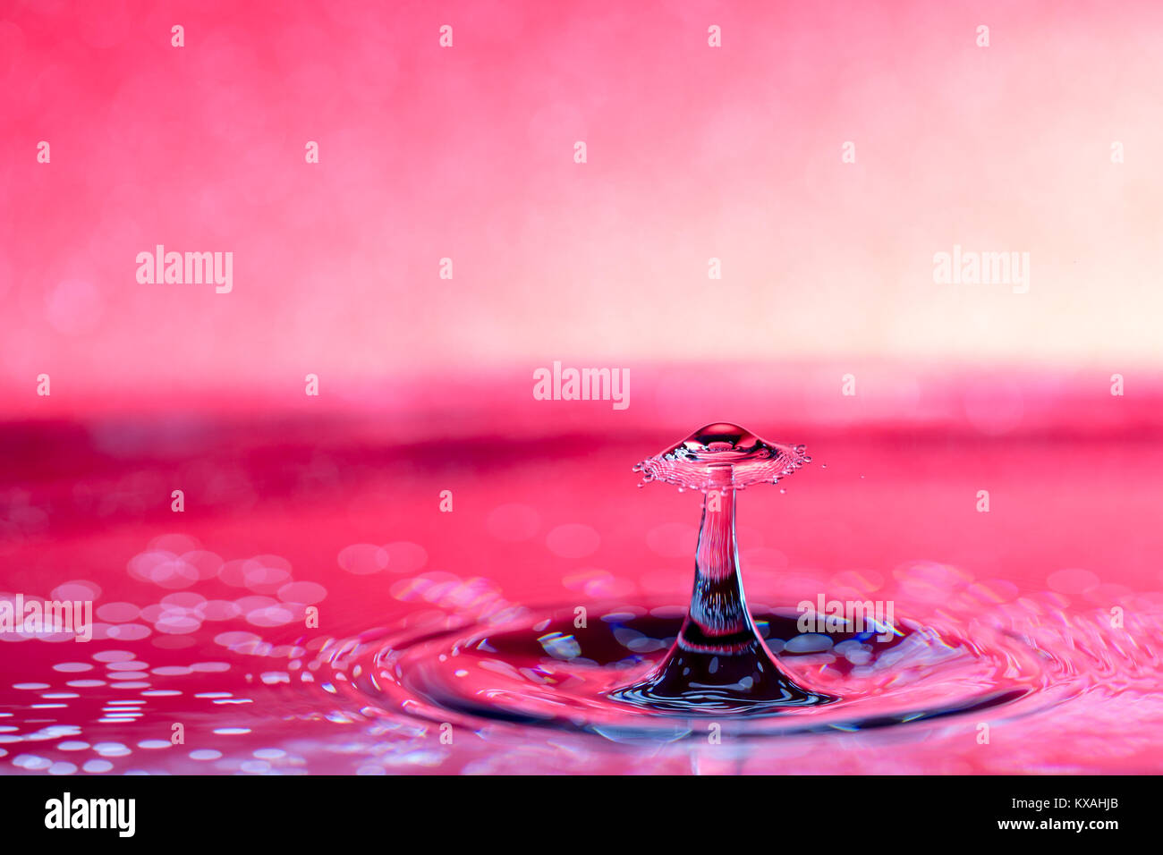 Photograph of Water droplets with a coloured background. also known as ...