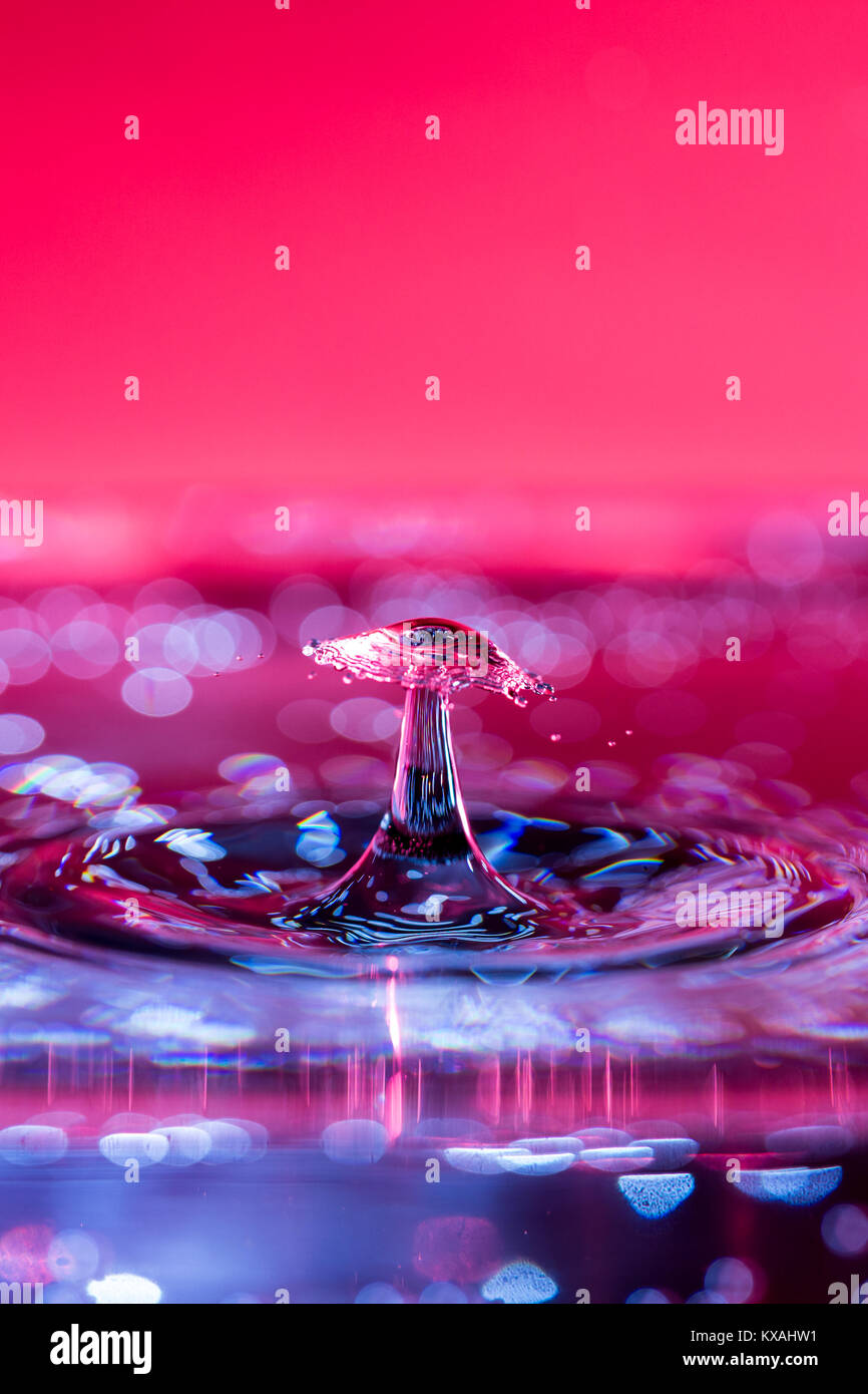 Photograph of Water droplets with a coloured background. also known as ...