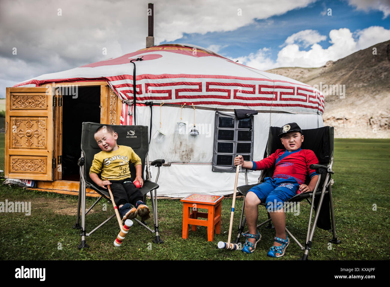 Boys sitting outside hi-res stock photography and images - Alamy