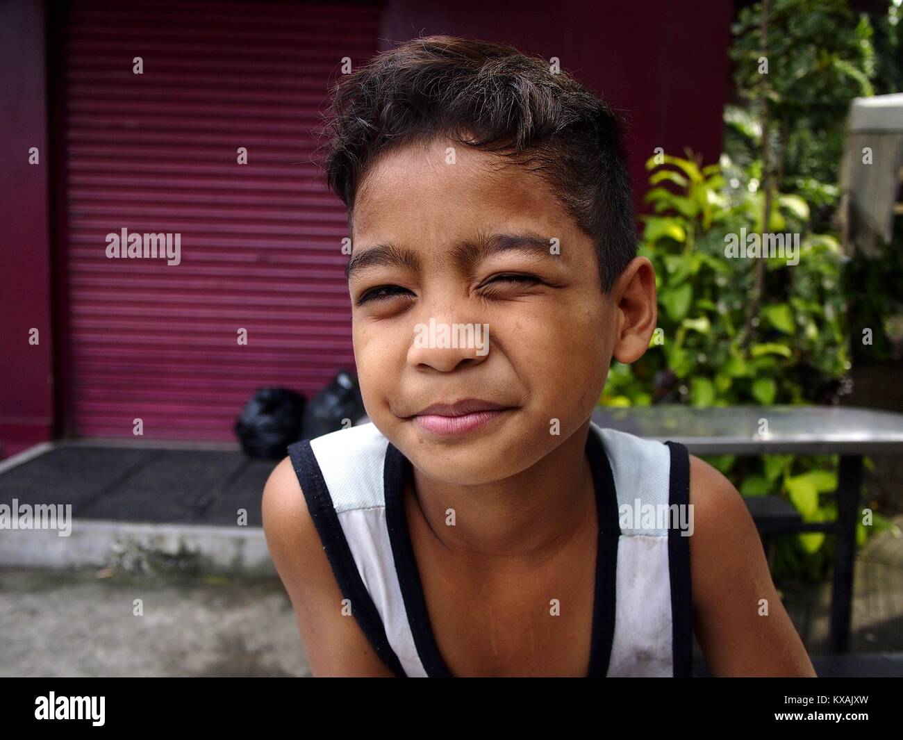 ANTIPOLO CITY, PHILIPPINES - DECEMBER 28, 2017: A boy pose and smiles ...