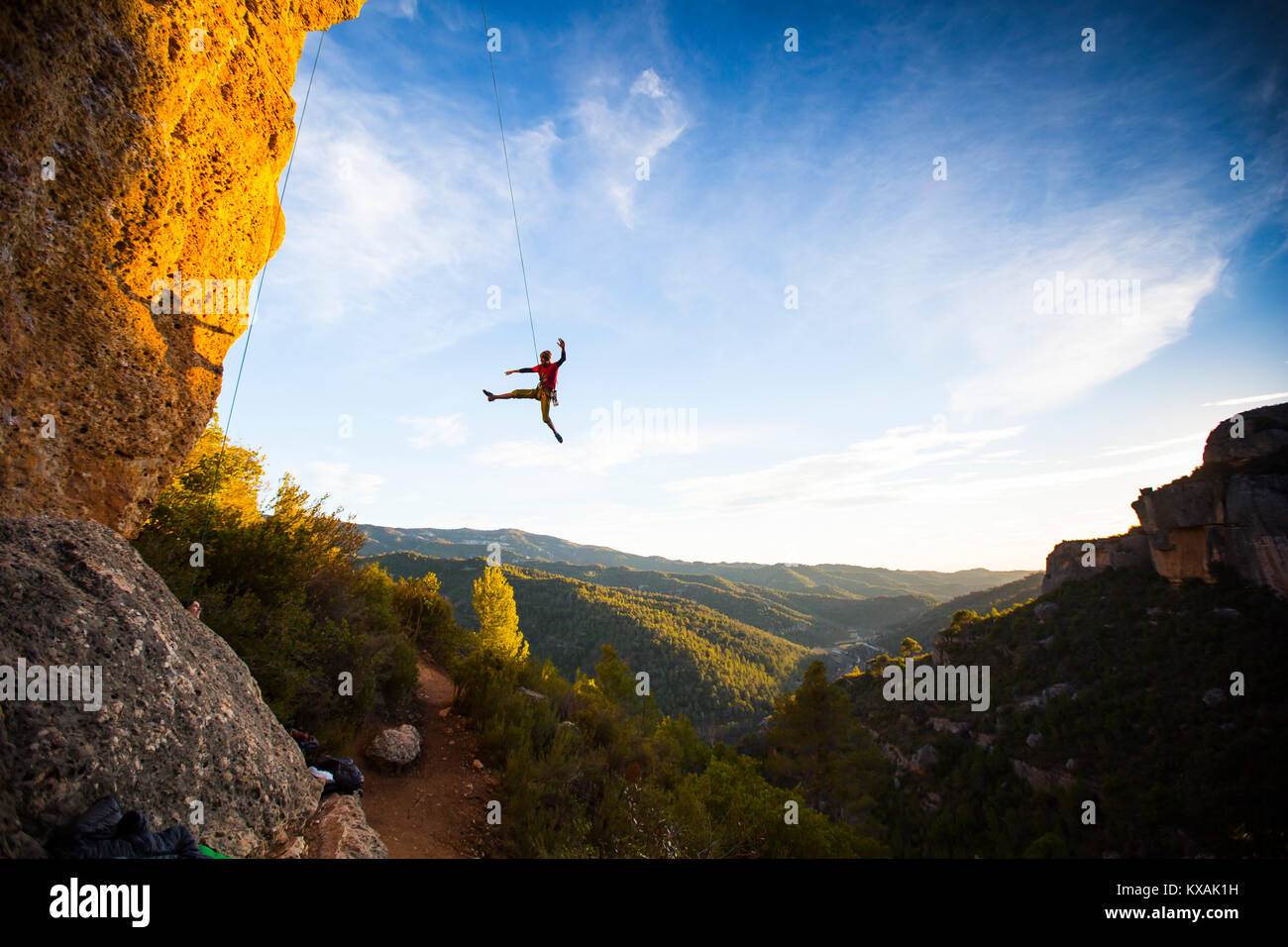 Man swinging from line after climbing, Magaluf, Catalonia, Spain Stock ...