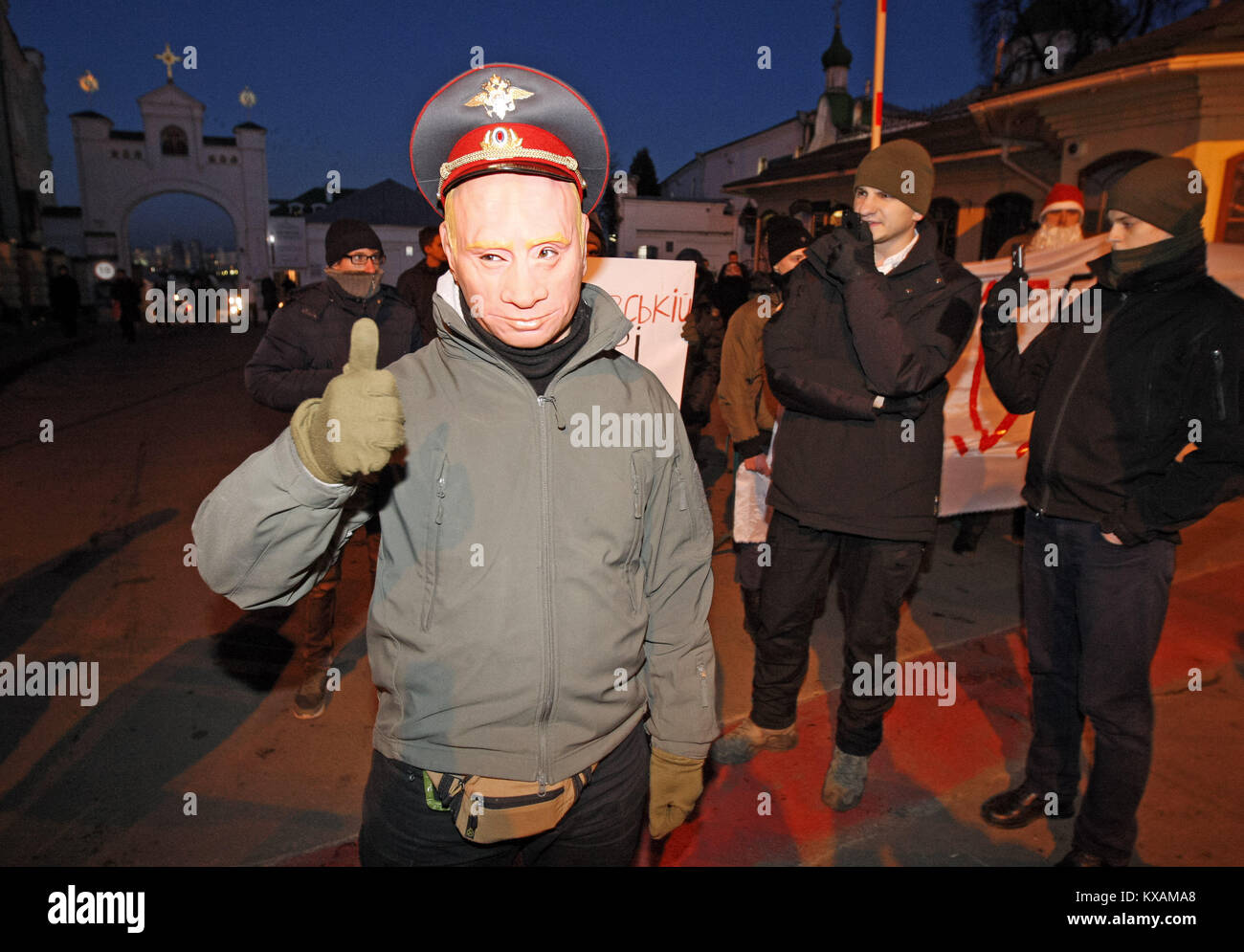 Kiev, Ukraine. 8th Jan, 2018. An activist with a mask depicting Russian ...