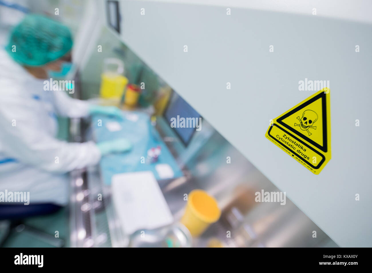 A warning sign indicating 'Zytostatika' appears in a laboratory where a ...