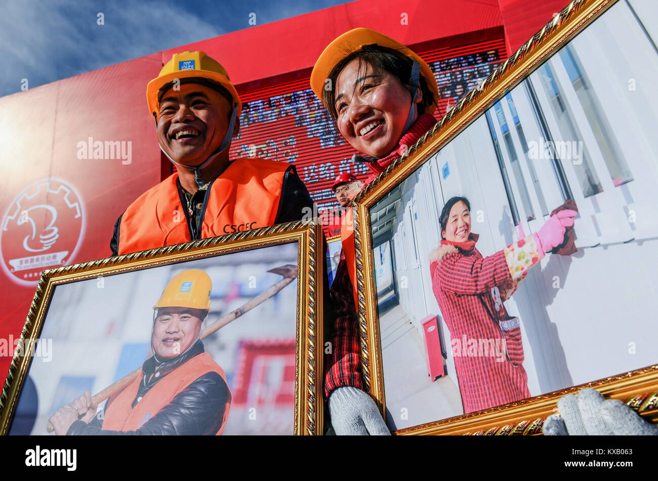 Beijing, China. 9th Jan, 2018. Construction worker Huang Chunping (L ...