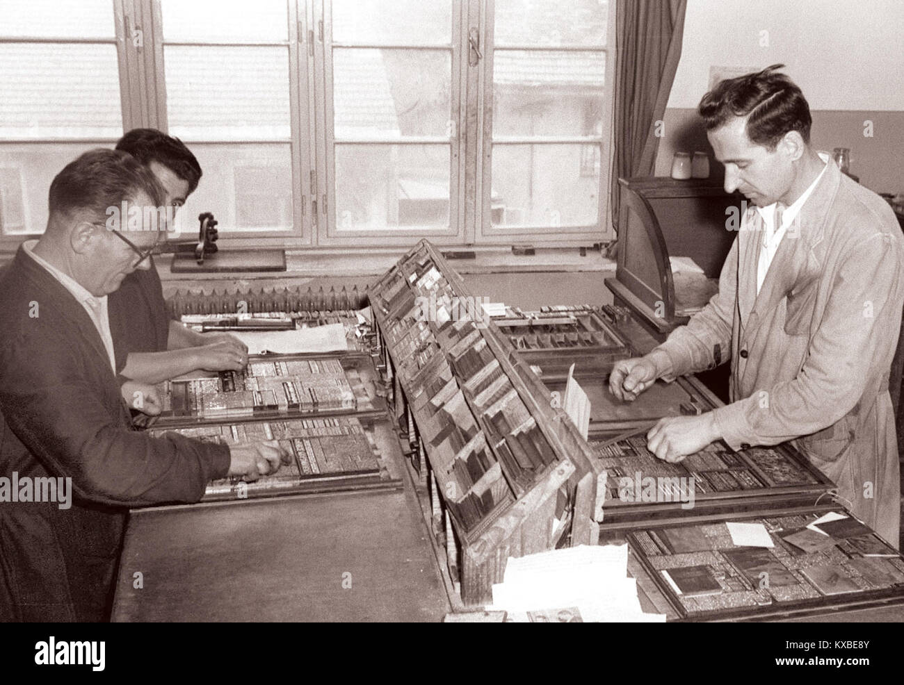 Image from 1960 showing the assembly of a newspaper page in lead type ...