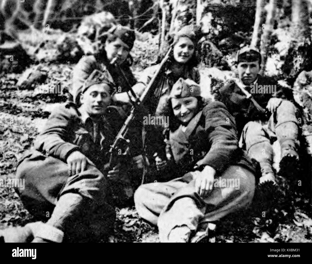 A historical photograph depicting a group of male and female partisans ...