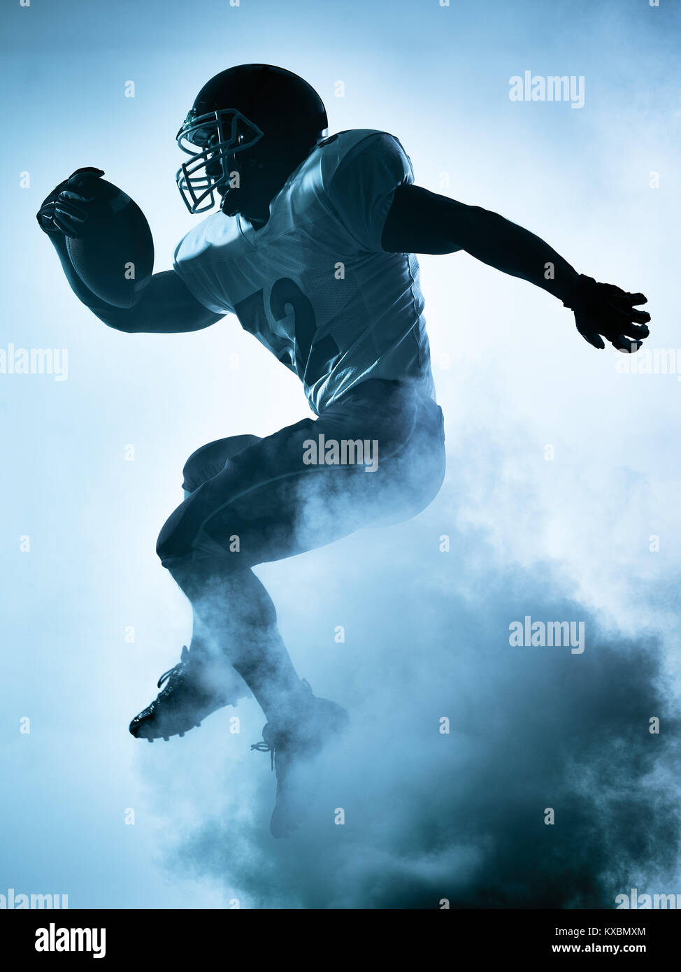 one american football player portrait in silhouette shadow on white ...