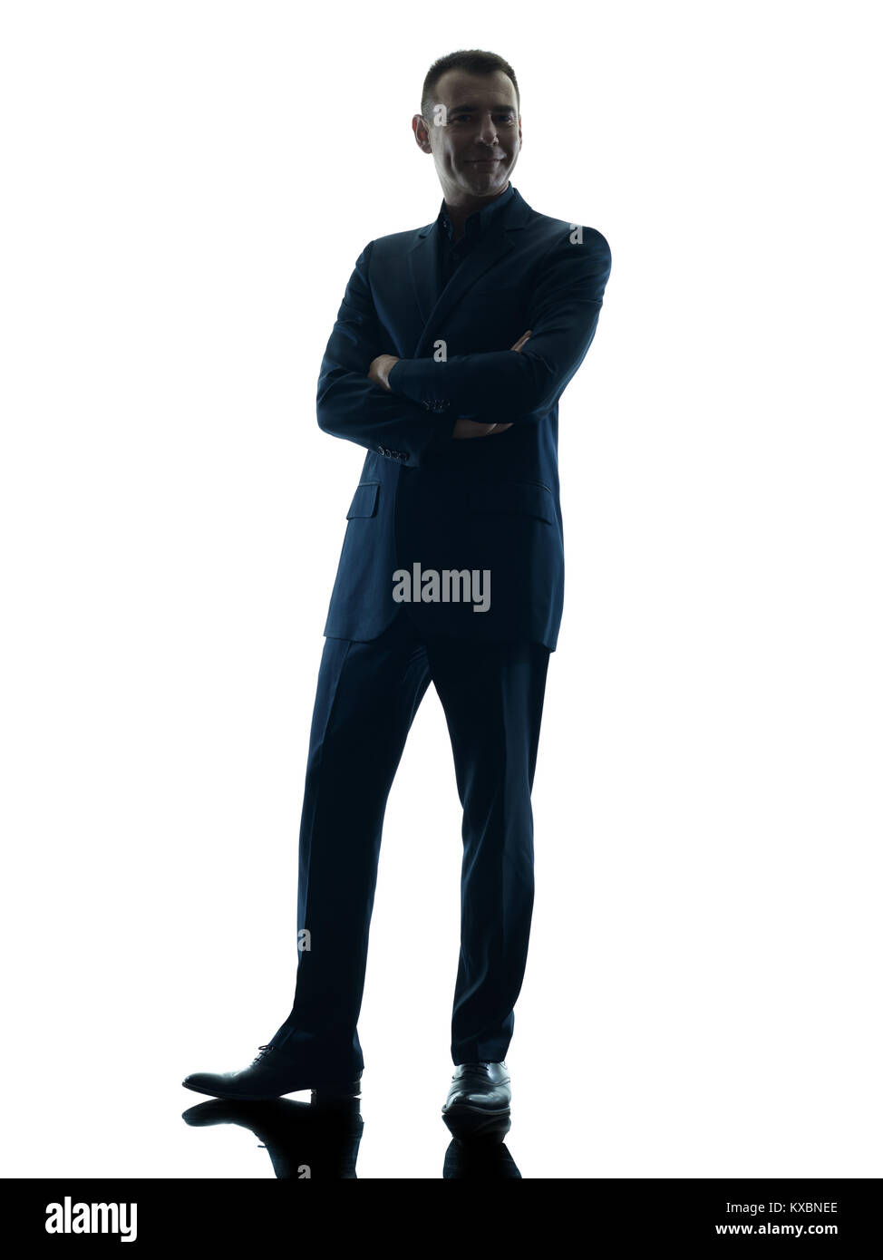 one caucasian business man standing silhouette isolated on white background Stock Photo - Alamy