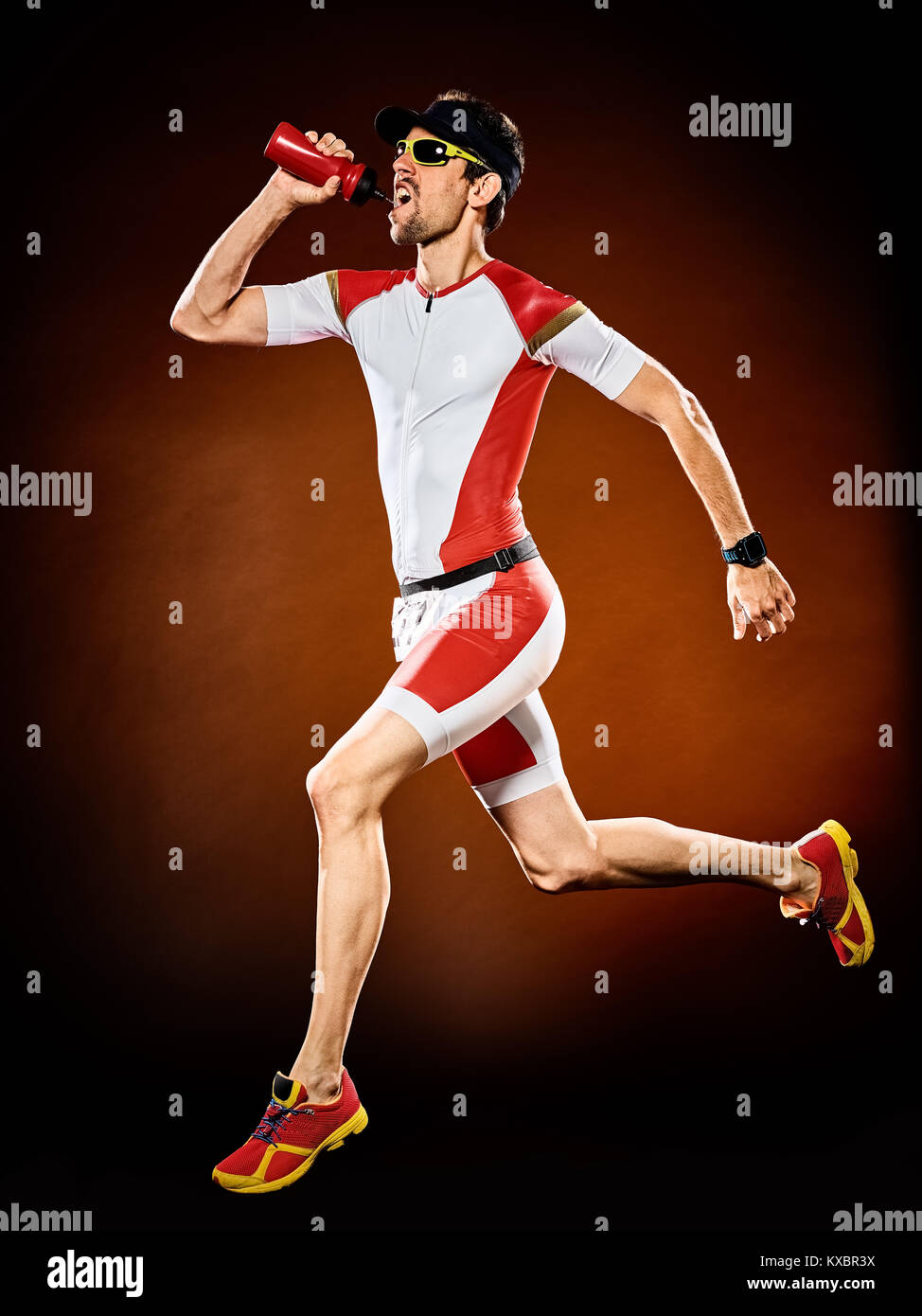 one caucasian man runner running triathlon ironman isolated Stock Photo ...