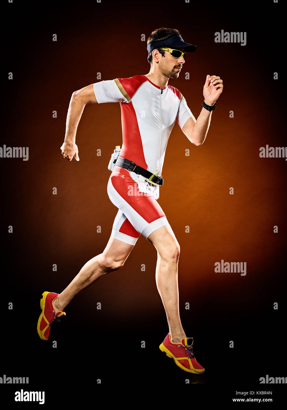 one caucasian man runner running triathlon ironman isolated Stock Photo ...