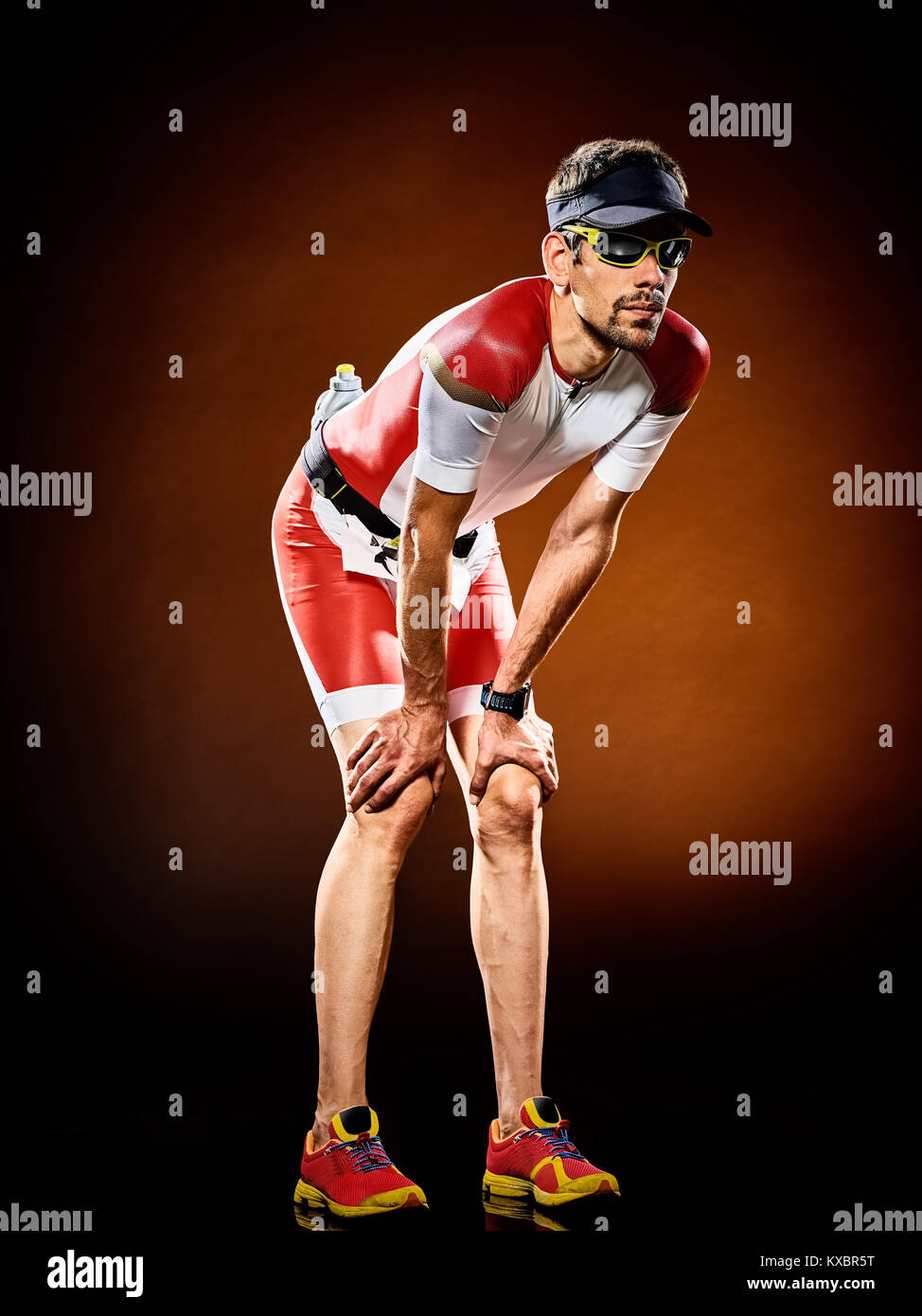 one caucasian man runner running triathlon ironman isolated Stock Photo ...