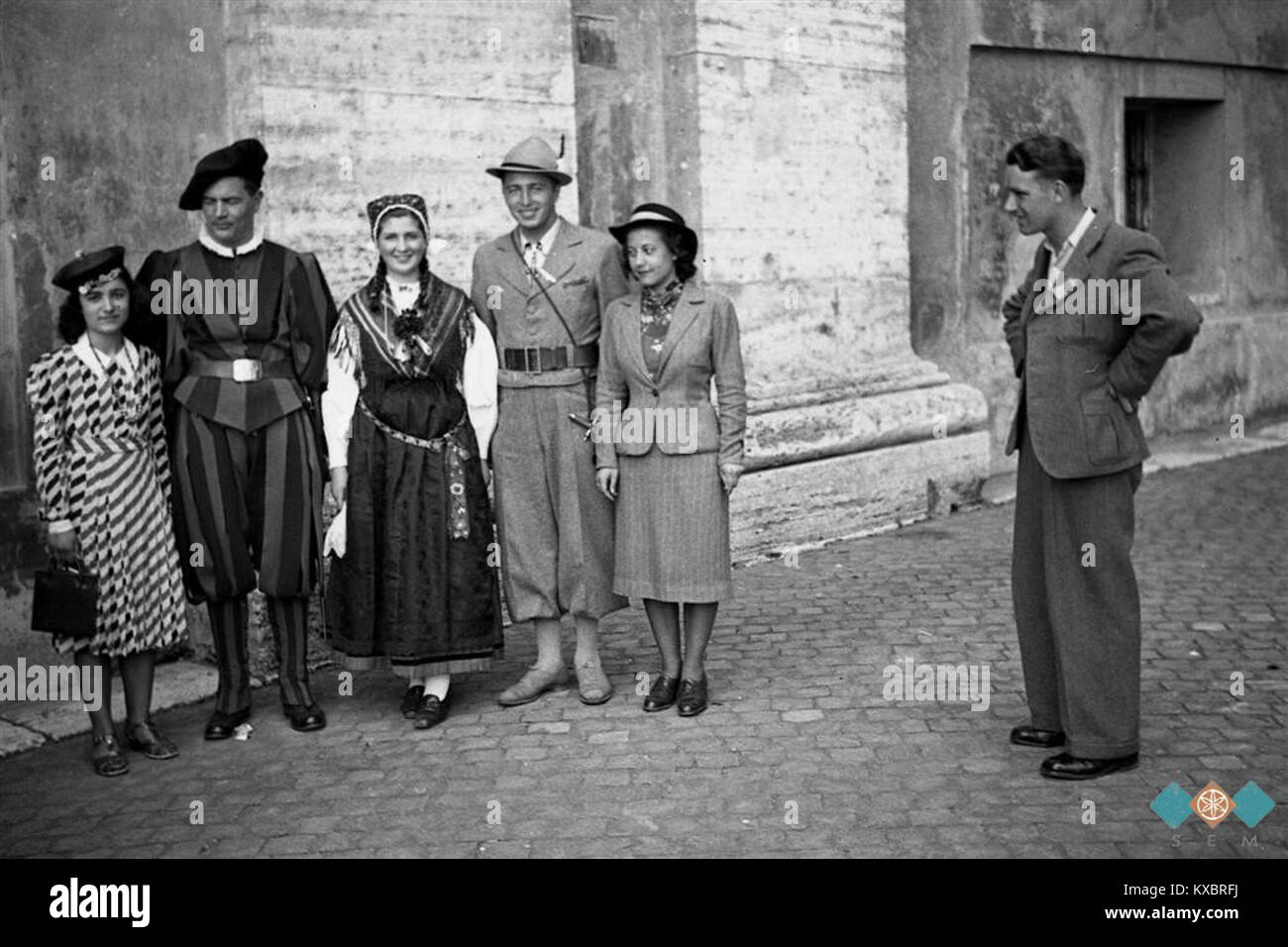 A 1934 photograph depicting Slovenian and Italian pilgrims posing with ...