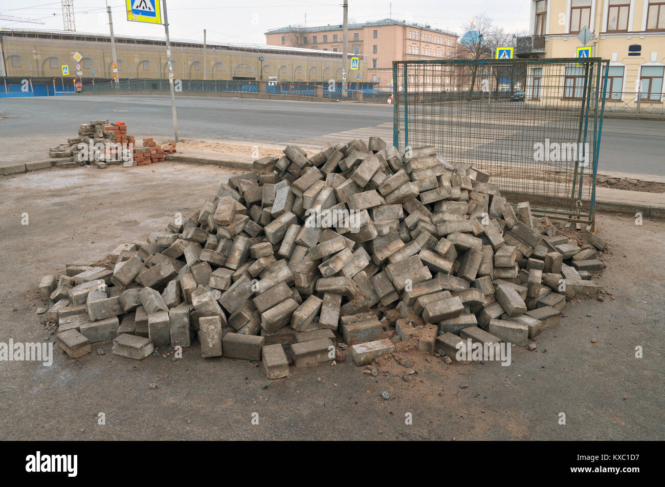 A large pile of stone blocks, lying in the street of the city Stock ...