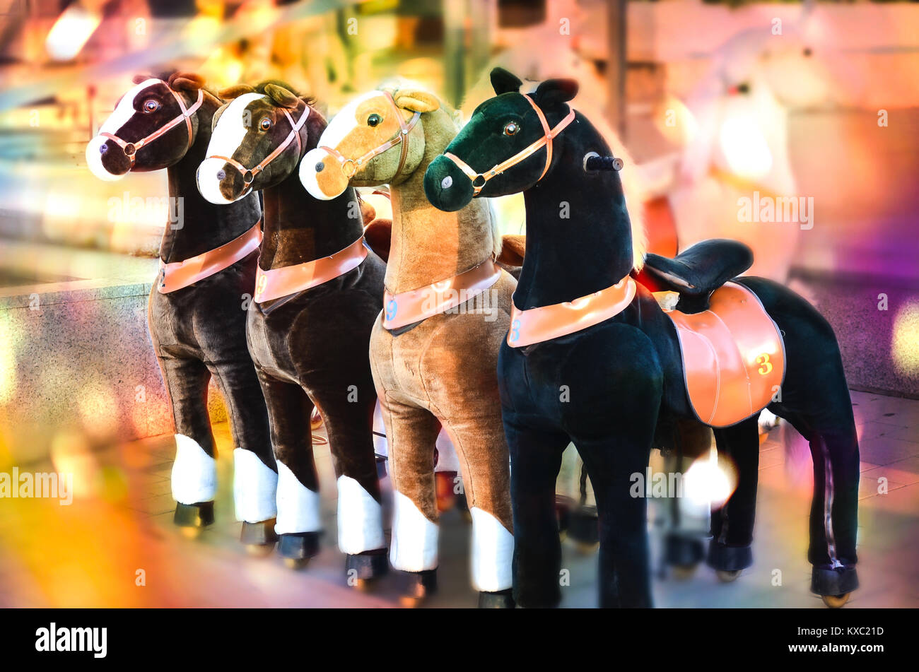 Toy stand with horses on wheels and other animals with color effects ...