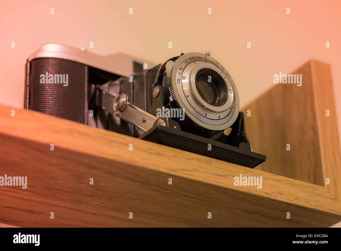 Old fashioned photography camera on wooden shelf, effects applied Stock ...
