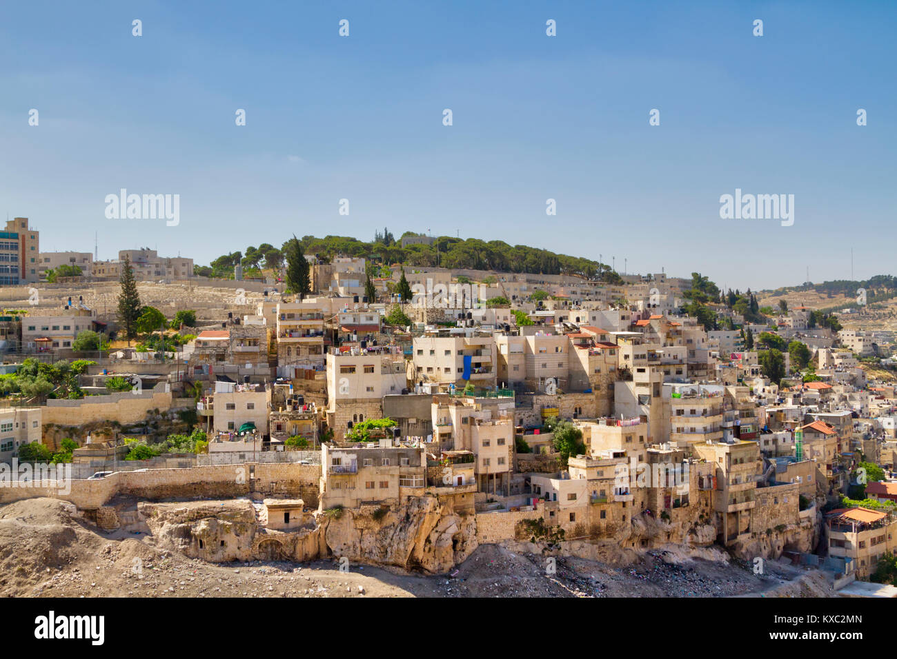 Panoramic view of Jerusalem neighborhood with old houses carved in ...