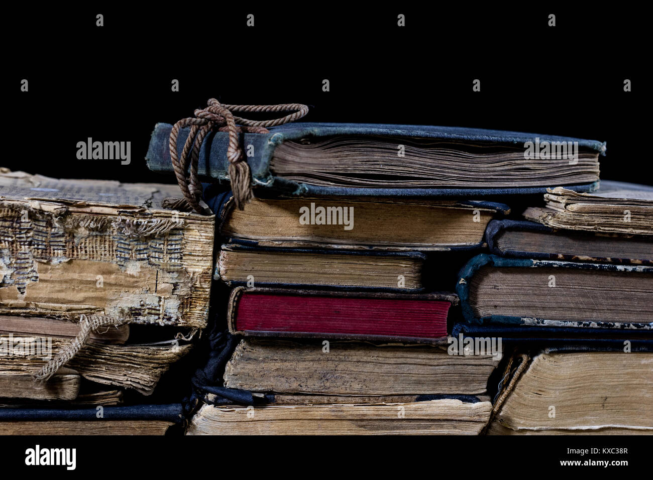 Old destroyed books on a wooden table. Reading room library with very ...