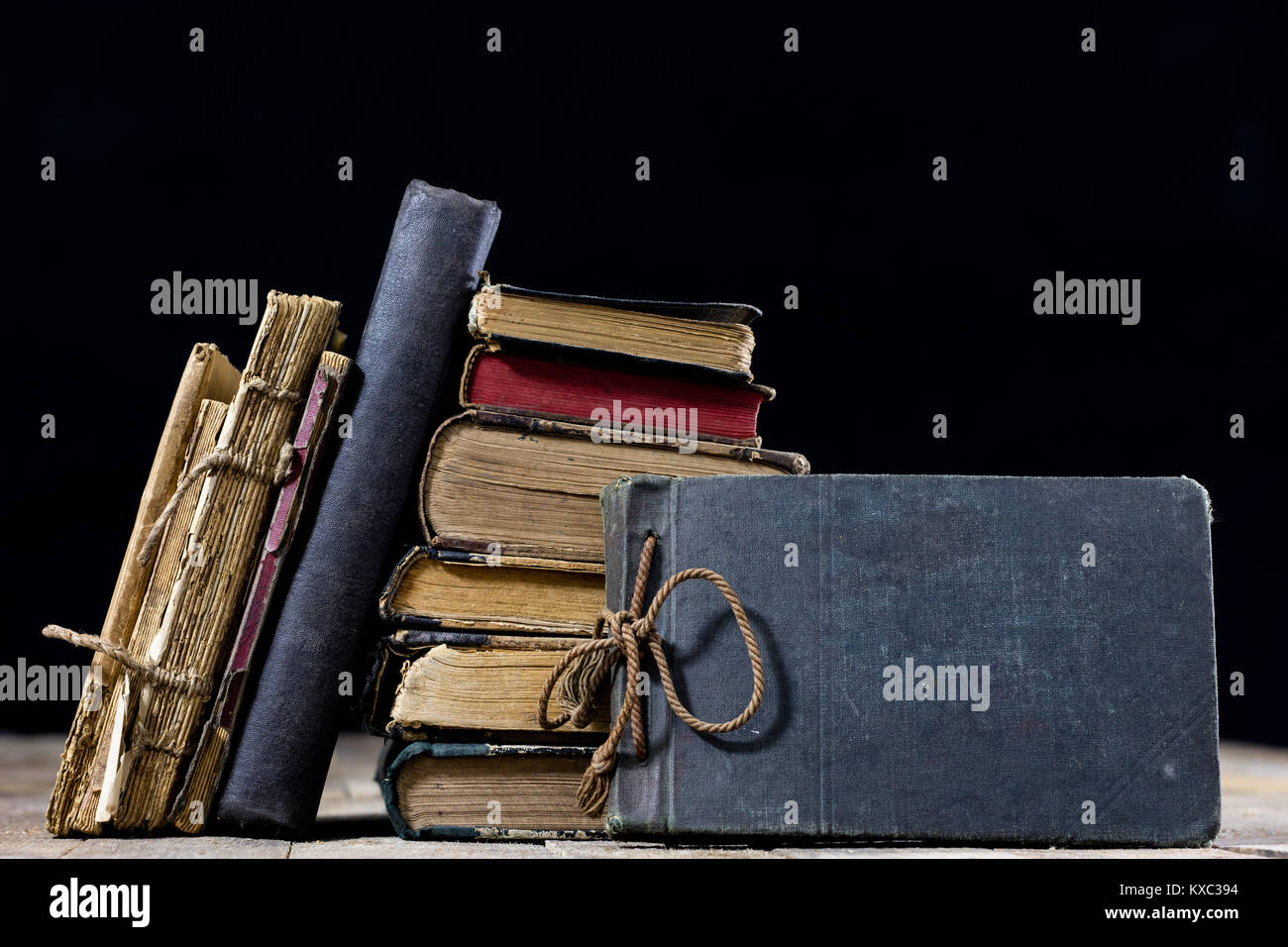 Old destroyed books on a wooden table. Reading room library with very ...
